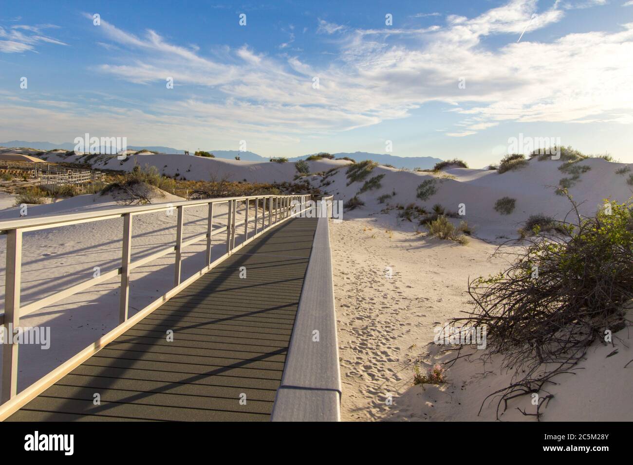 Hiking In The Desert. Boardwalk hiking trail through the White Sands ...