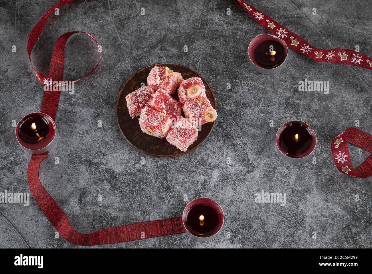 Red lokum candies in a saucer Stock Photo - Alamy