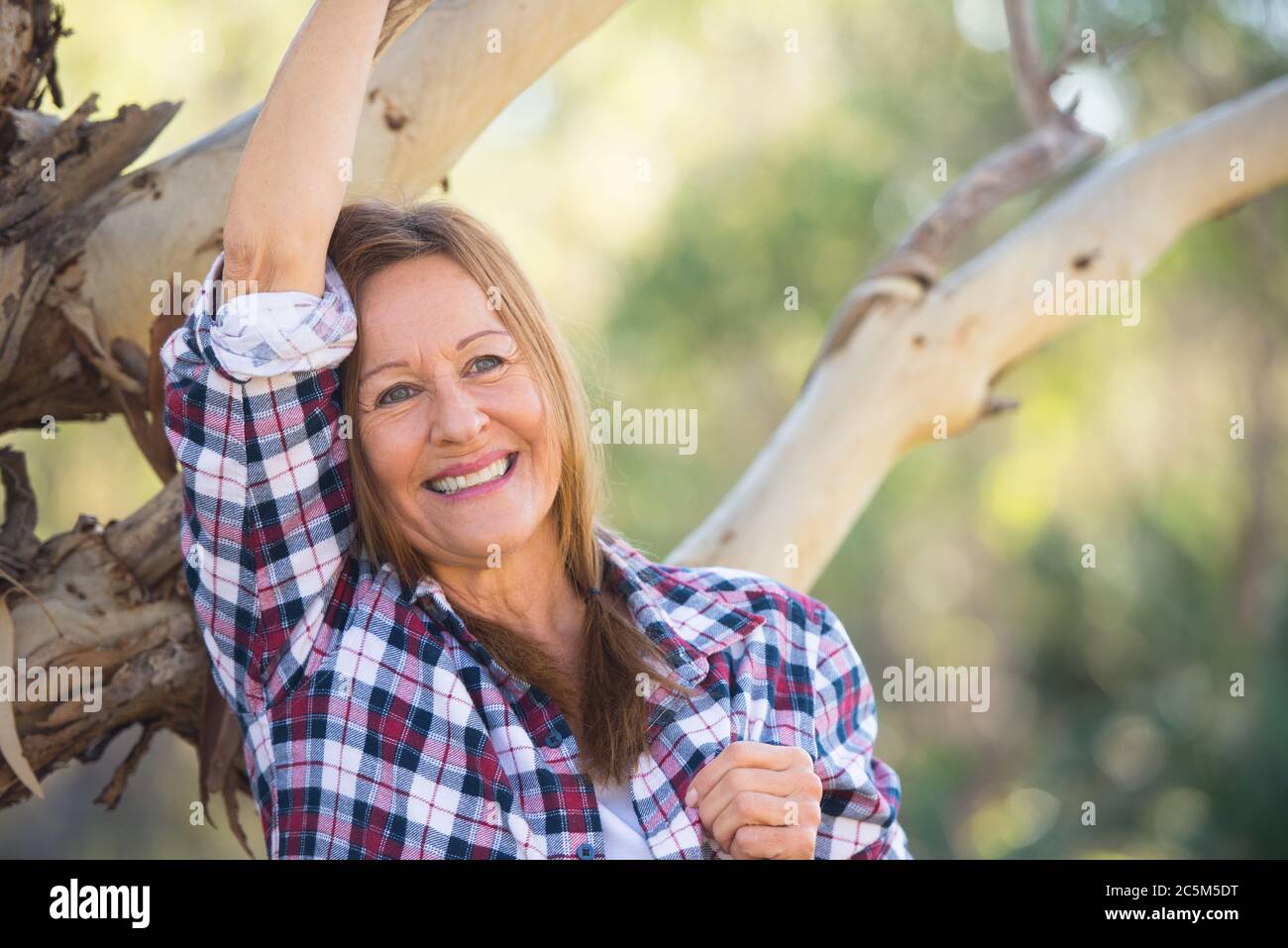 Portrait Attractive Mature Woman In Rural Country Wearing Plaid Shirt Posing Relaxed With