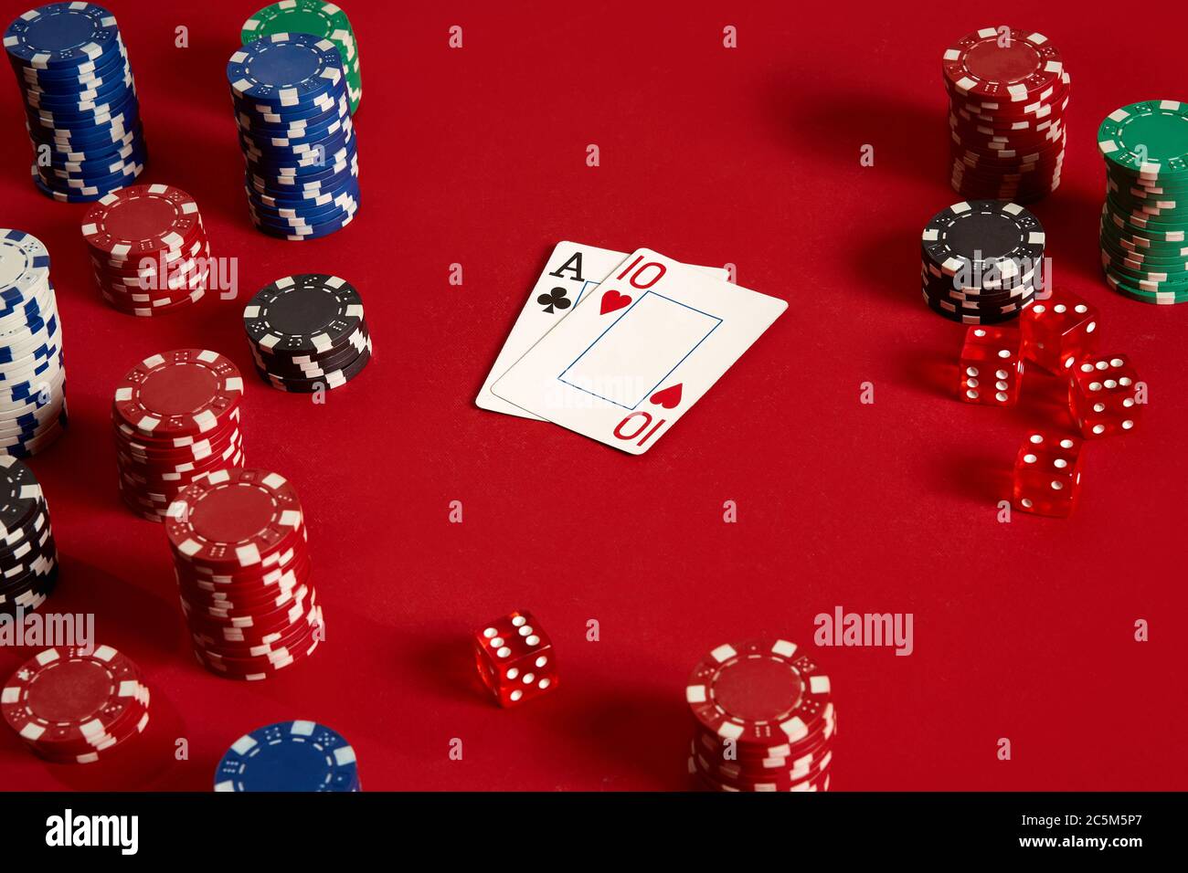 Two cards and chips on a red background. Big bet of game money. Cards ...