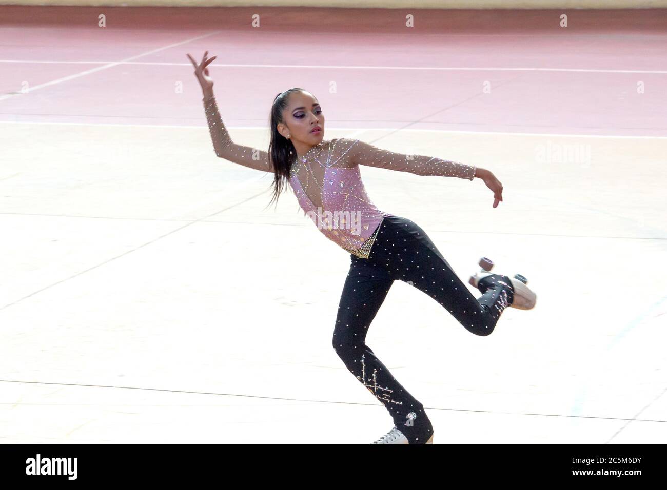 Teenage girl in elegant figure skating routine Stock Photo - Alamy