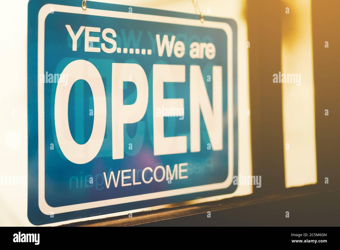 A business sign that says open on cafe or restaurant hang on door at ...