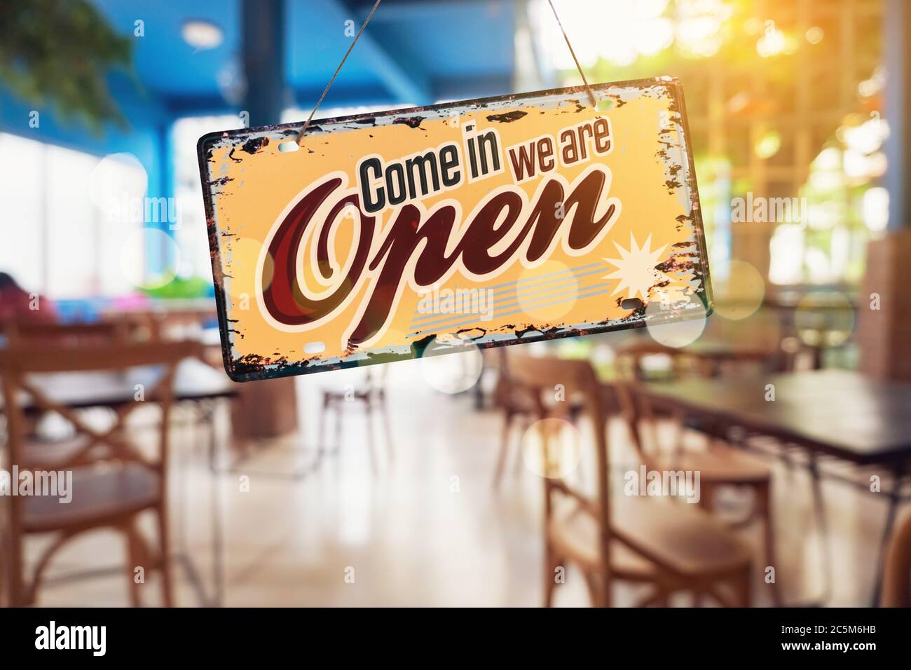 A business sign that says open on cafe or restaurant hang on door at ...
