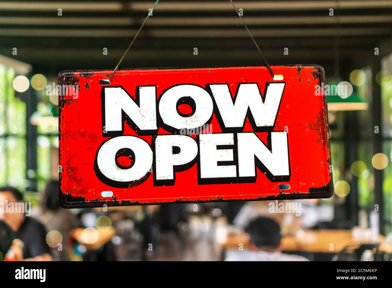 A business sign that says open on cafe or restaurant hang on door at ...