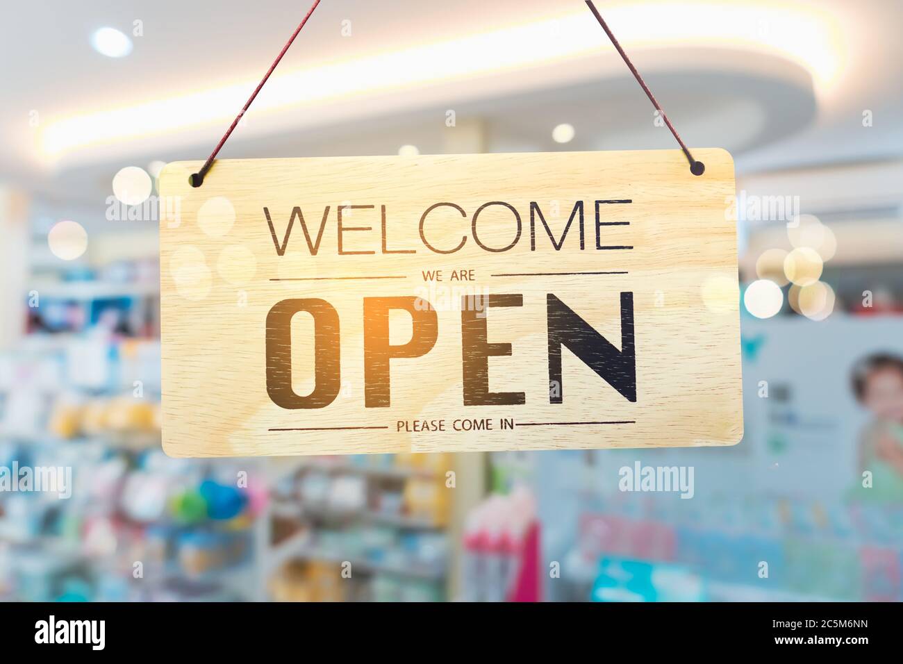 A business sign that says open on cafe or restaurant hang on door at ...