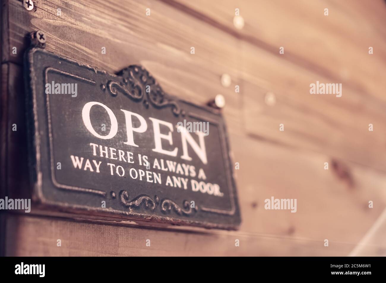 A business sign that says open on cafe or restaurant hang on door at ...