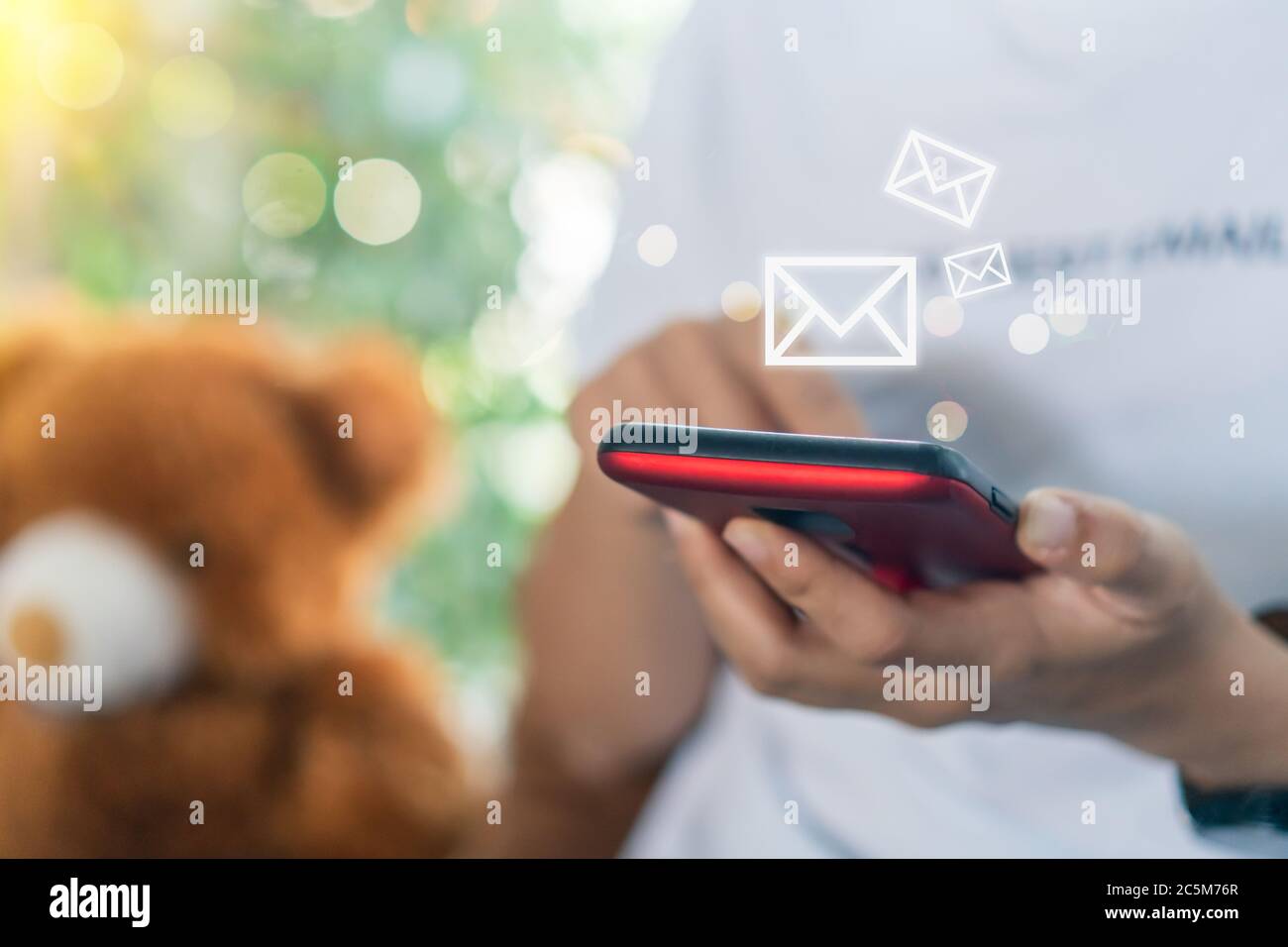 Woman hand using smartphone and it's show email recieve notification ...