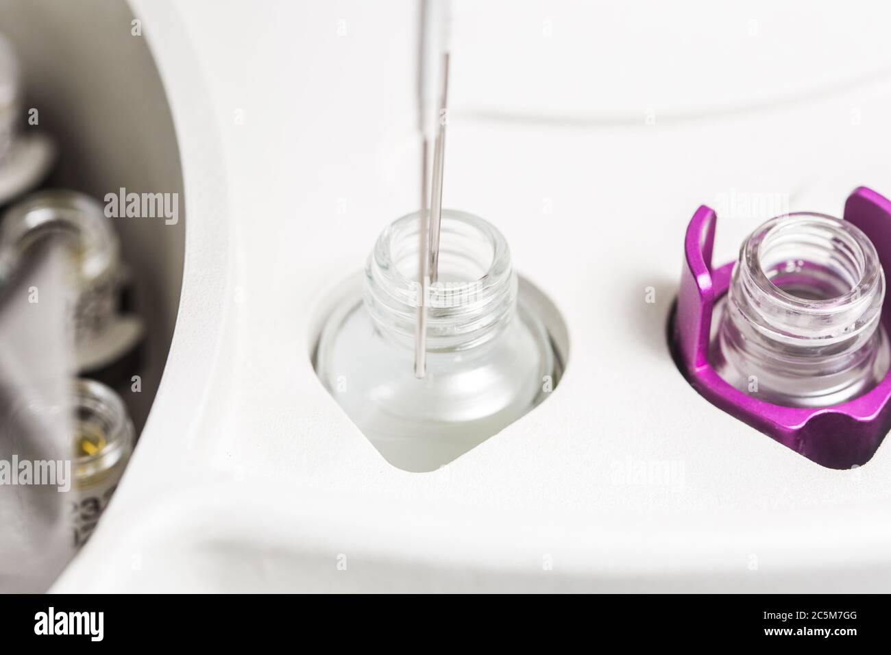 Small tube to machine in laboratory Stock Photo - Alamy