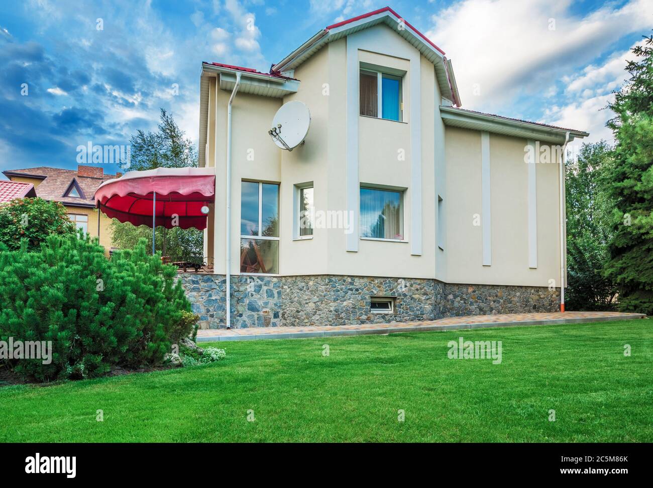 Beautiful house with a lawn Stock Photo - Alamy