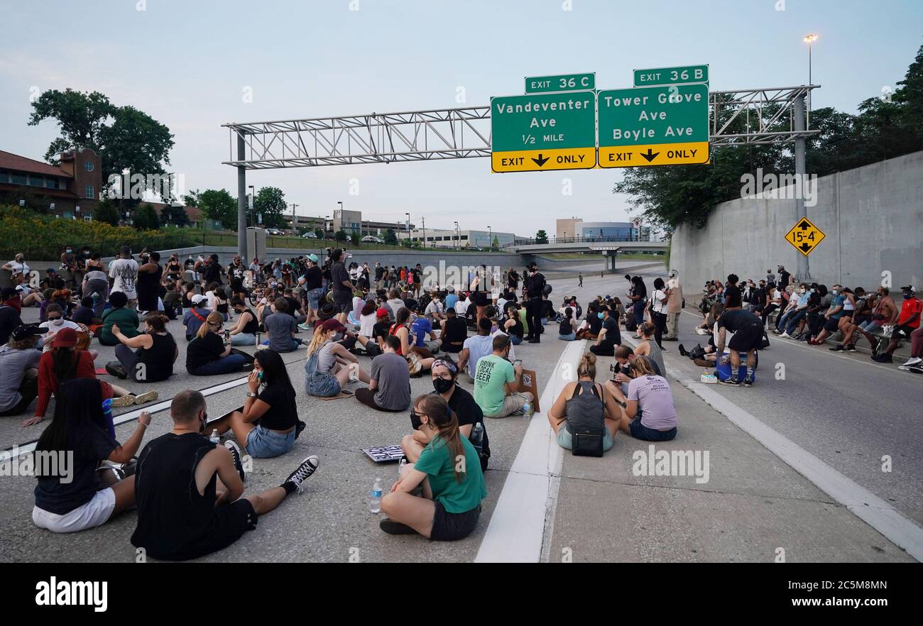 St. Louis, United States. 03rd July, 2020. Protesters sit down on ...