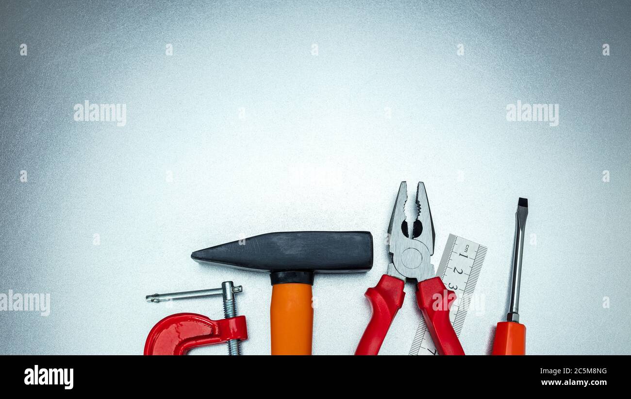 set of different working hand tools for home renovation on grey ...