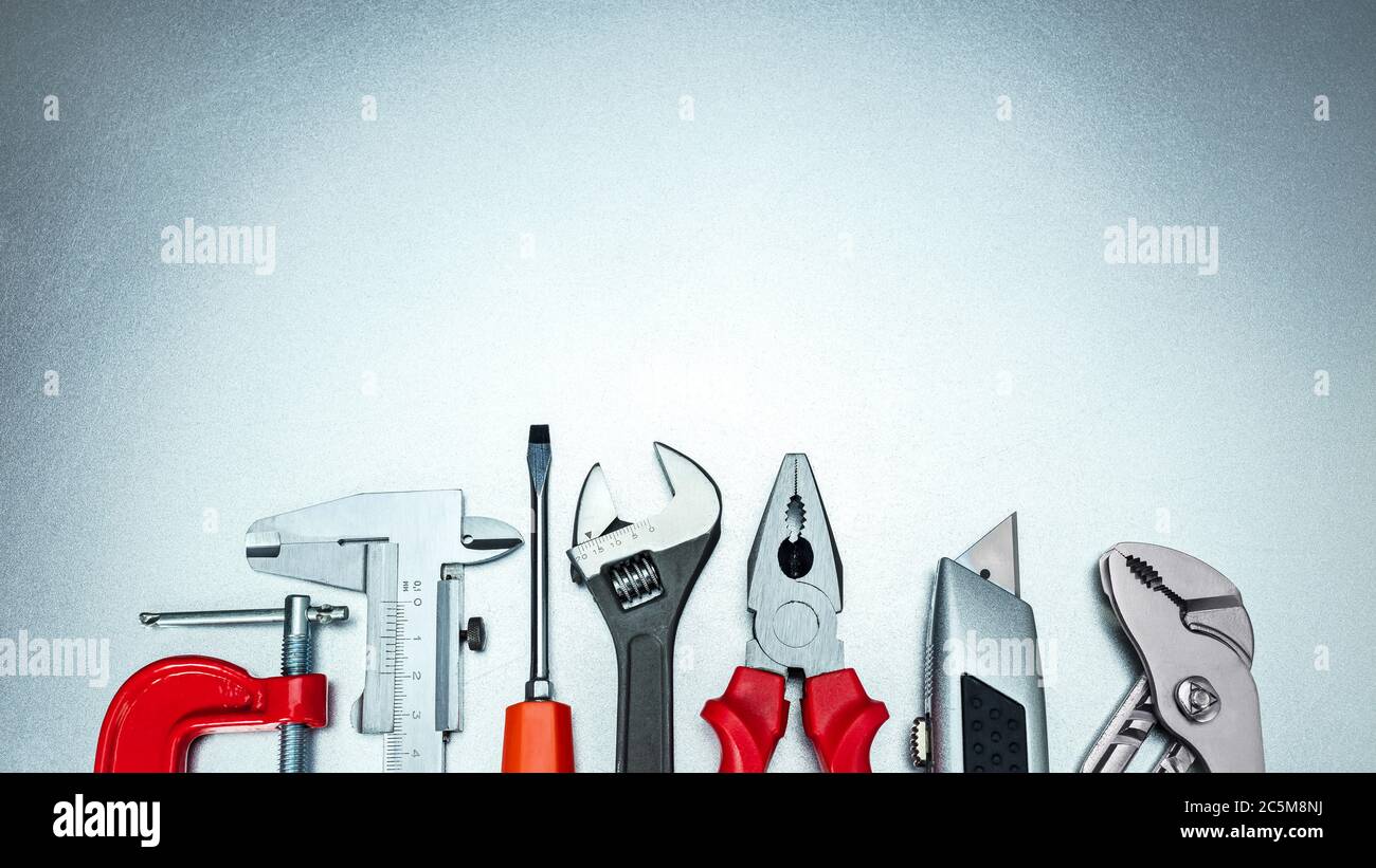 set of various hand tools on grey background top view including ...