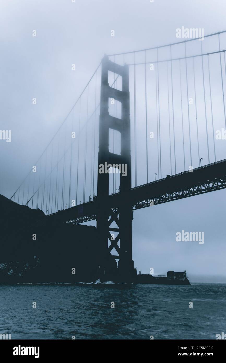 Moody photo of the Golden Gate Bridge from a Yacht. Foggy rainy day ...
