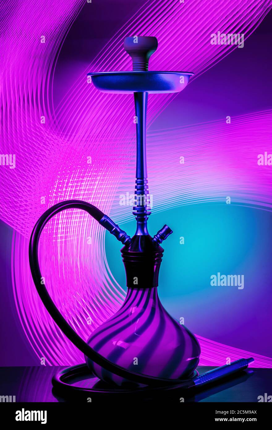 Blue hookah with black rubber tube and blue and white flask on ...