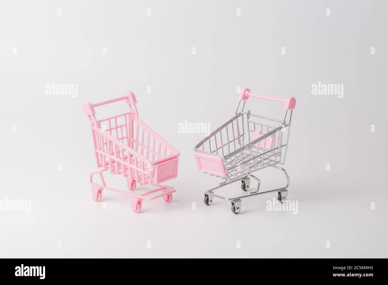 Shopping cart over white background Stock Photo - Alamy