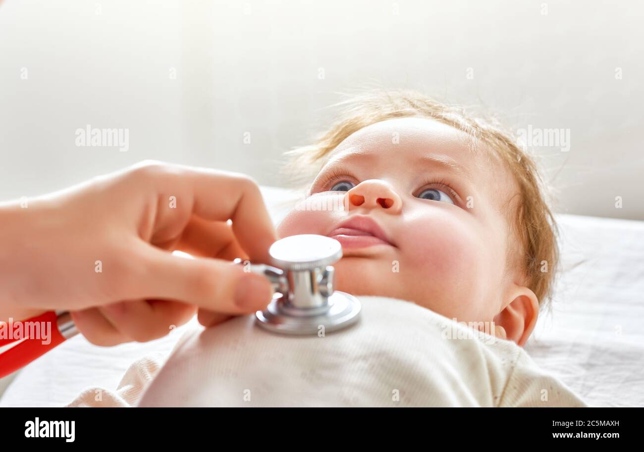 doctor examining a baby in a hospital Stock Photo - Alamy