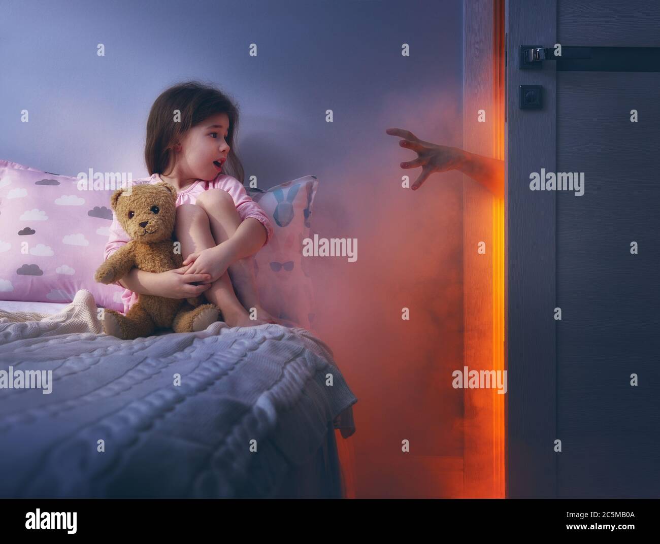 Nightmare for children. Little child girl is afraid of monsters in the ...