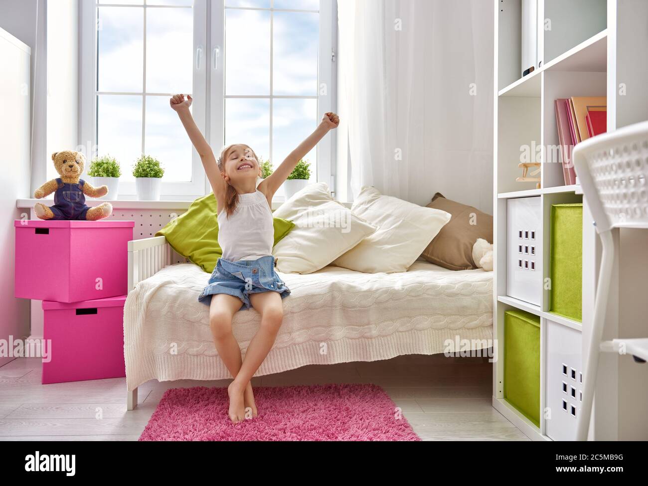 A nice child girl enjoys sunny morning. Good morning at home. Child ...