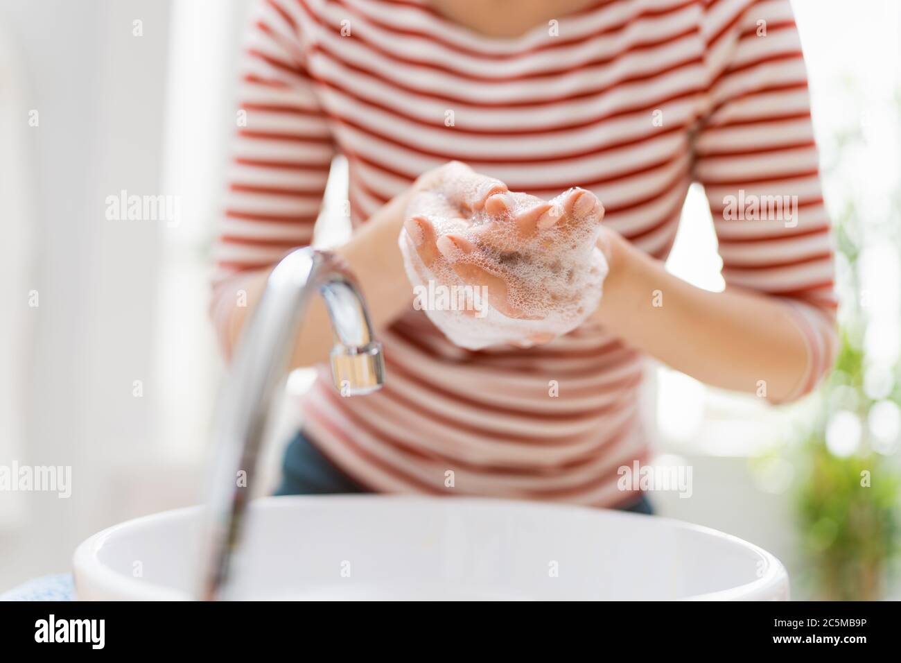 Person is washing hands rubbing with soap. Protection against ...