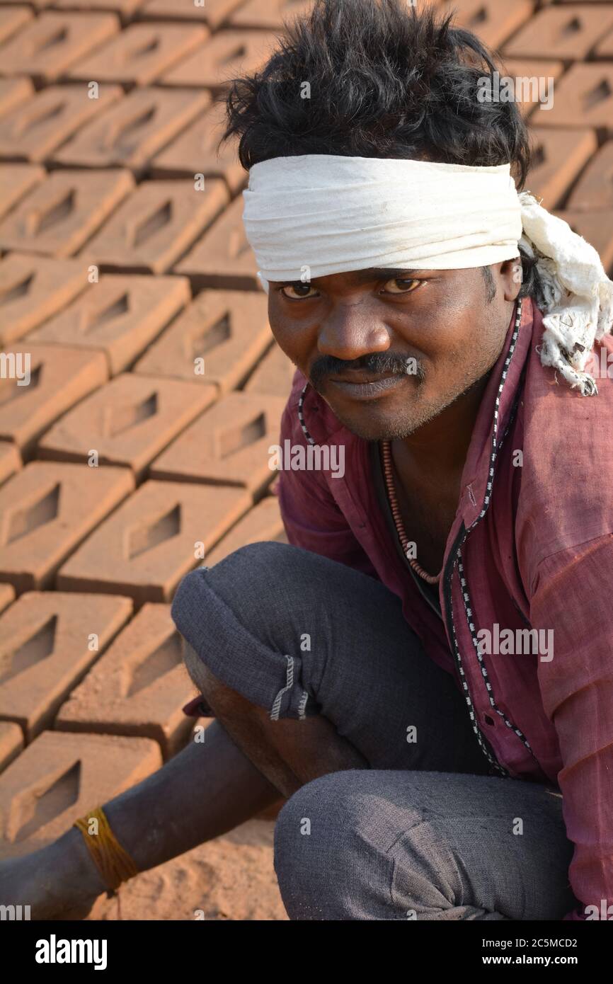 Man molding bricks hi-res stock photography and images - Alamy