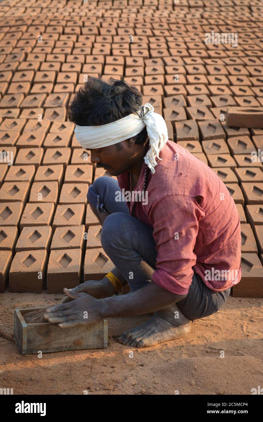 Man molding bricks hi-res stock photography and images - Alamy