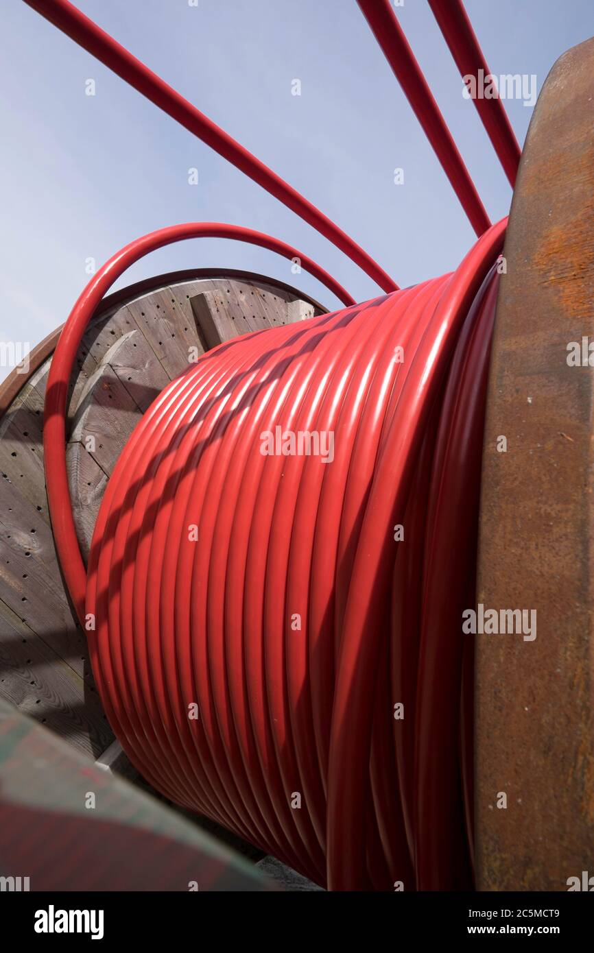 Wooden Coil of Red Electric Cable Outdoor. Vertical image Stock Photo ...