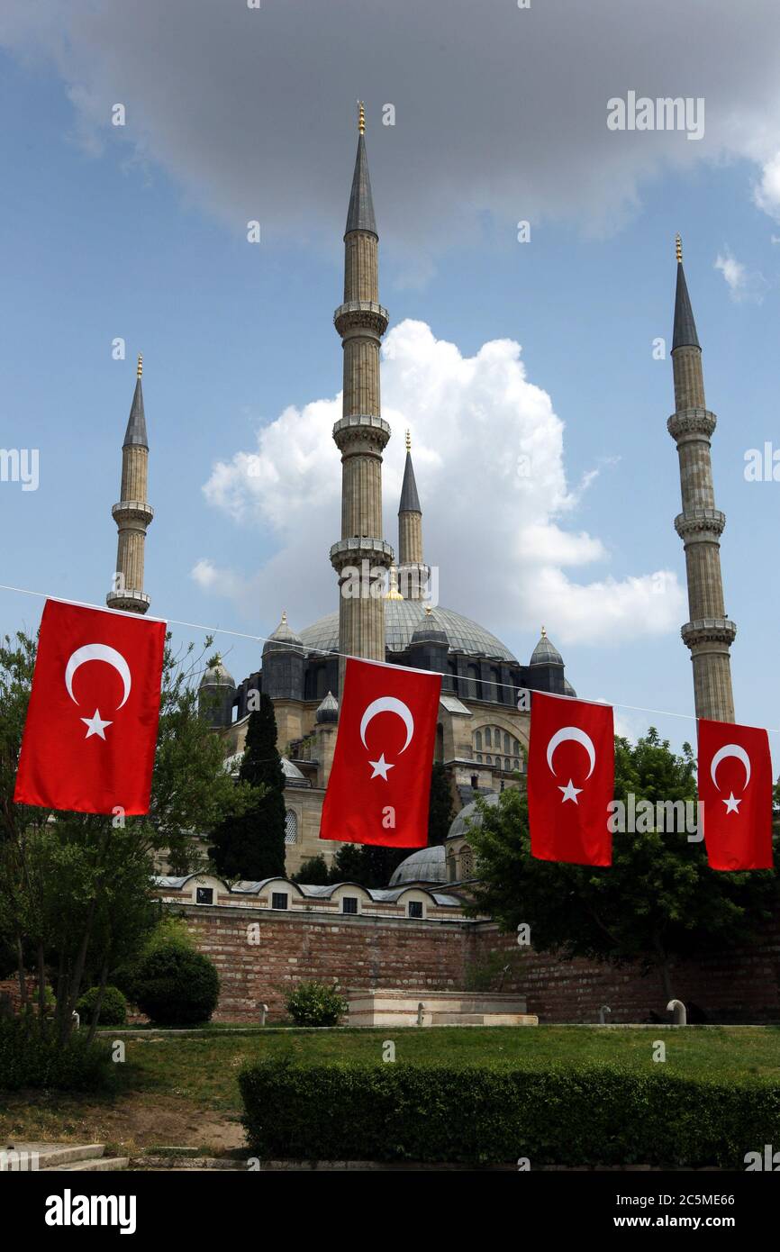 Turkish flags fly in front of the magnificent minarets of Selimiye ...
