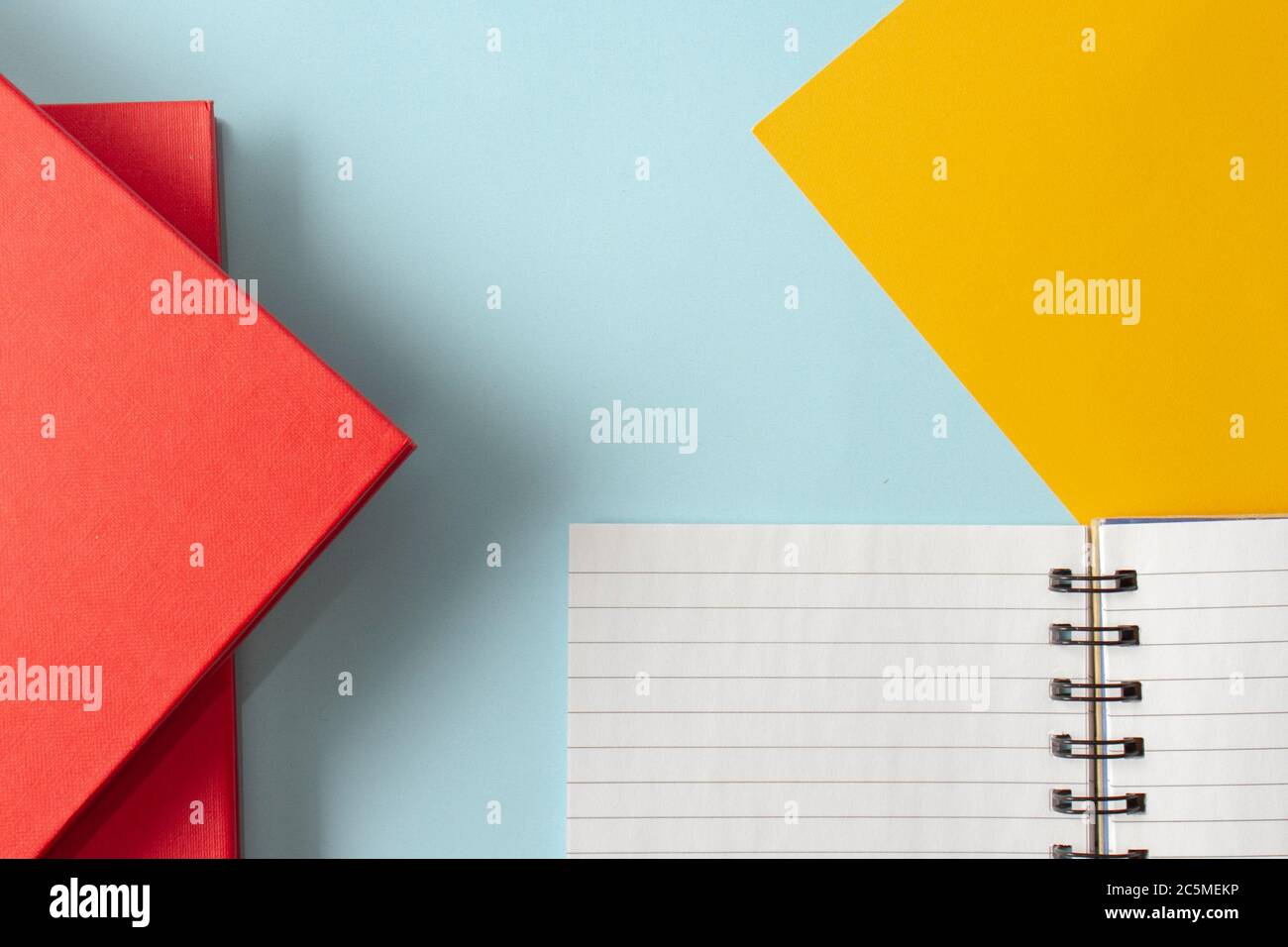 Notebook with blue background Stock Photo - Alamy