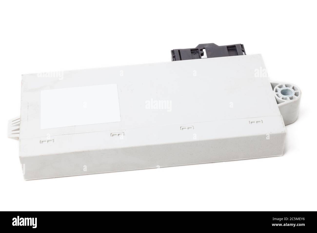 The plastic case of the car engine control unit on a white isolated ...