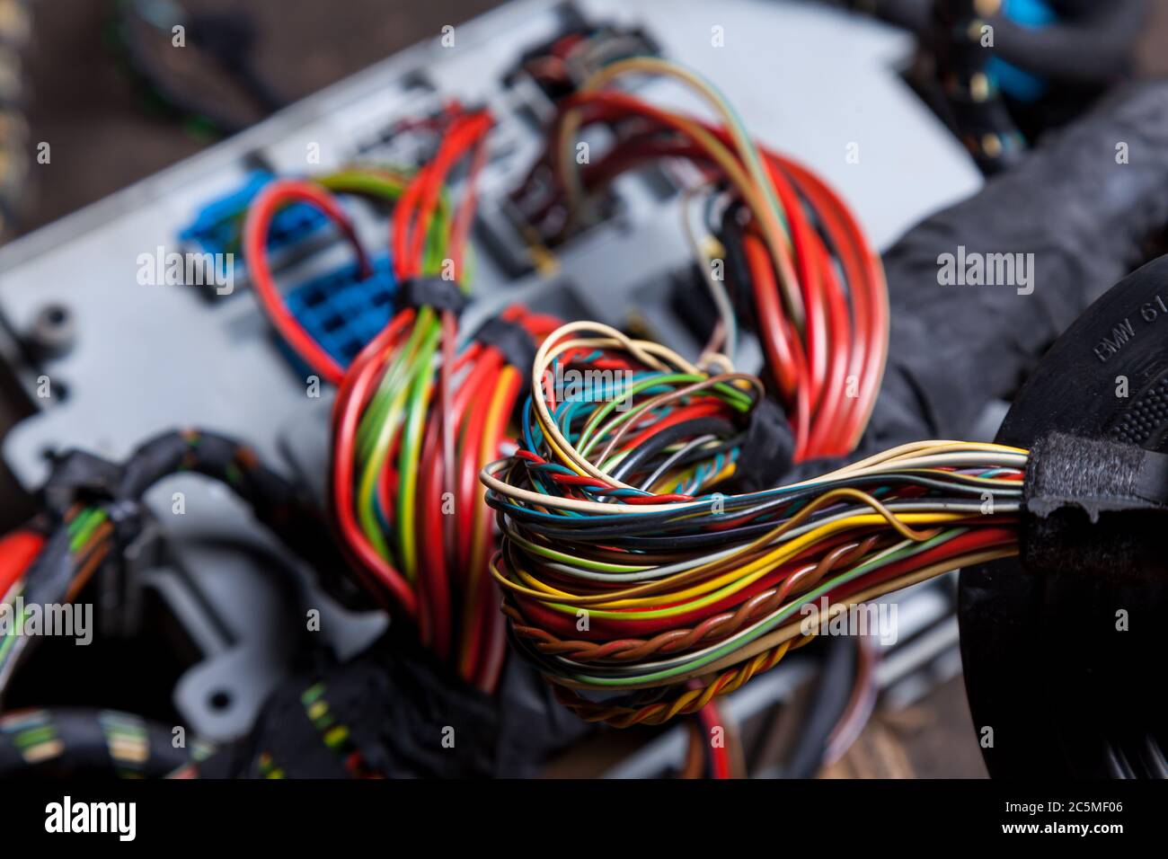 Close-up of a large cable of a coil of wires of different colors of ...