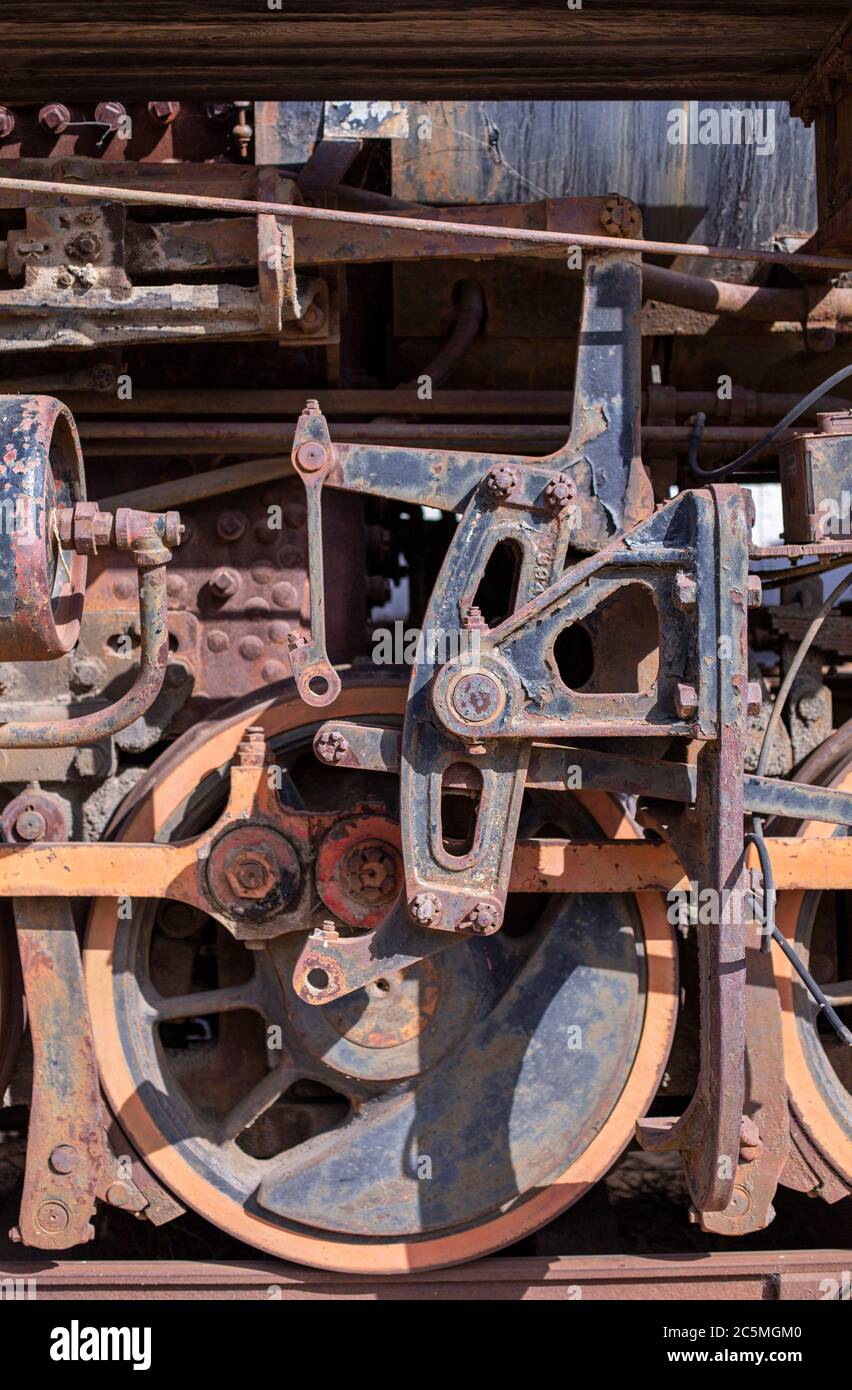 Rusty old valves, gauges and metal parts on an antique steam locomotive ...