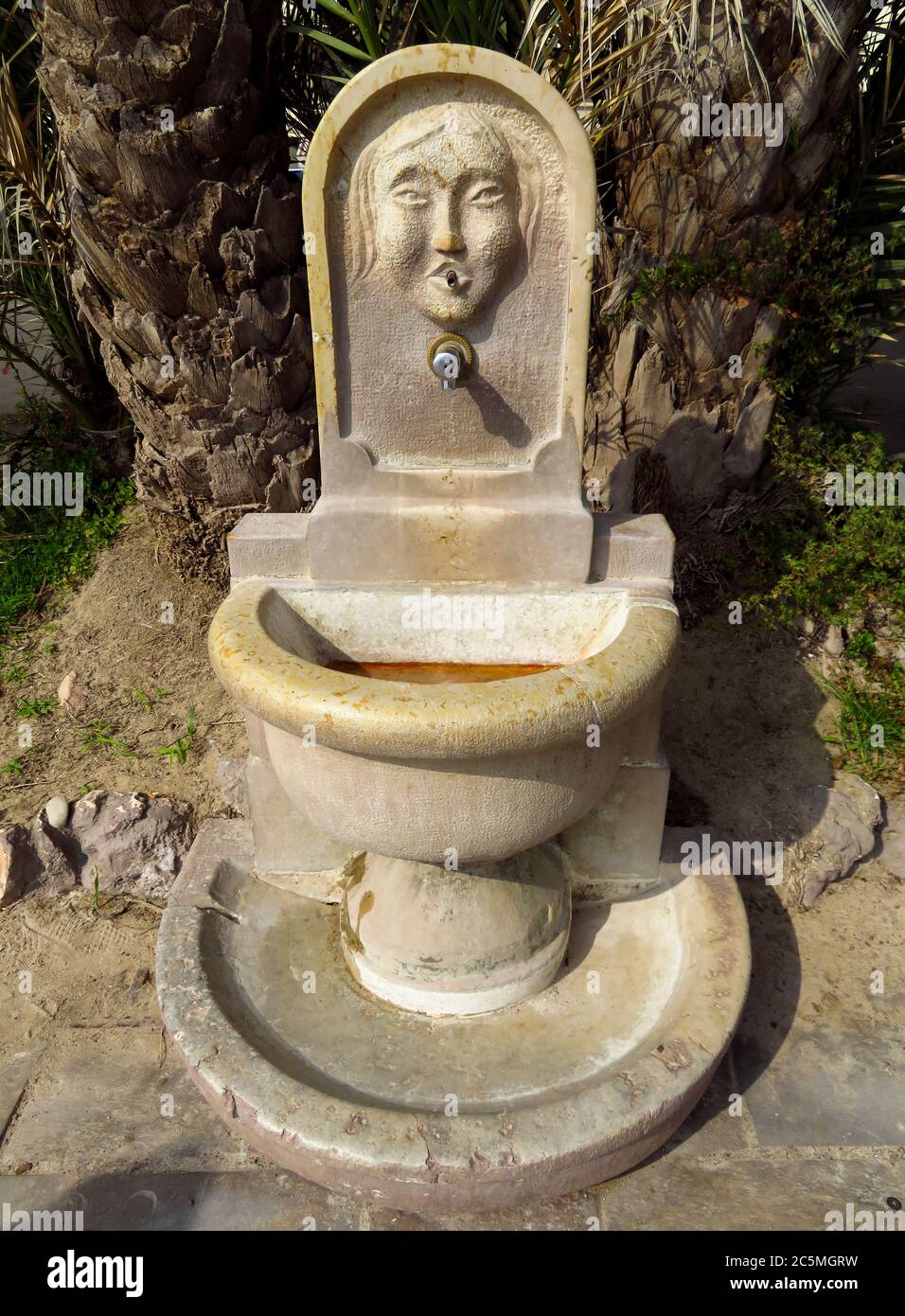 Sculpture woman face - public old drinking water source in Cannes ...