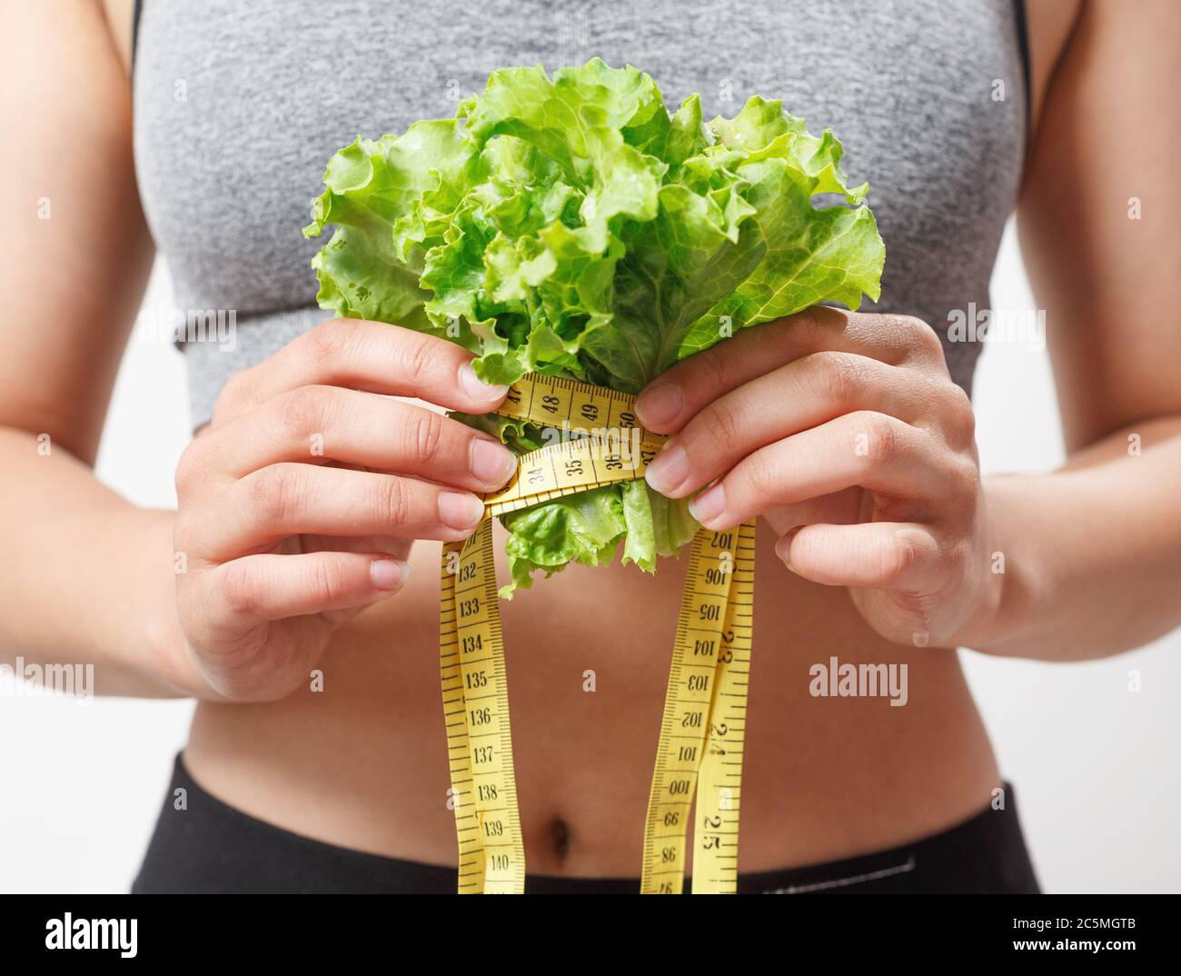 Body centimeter in hands hi-res stock photography and images - Alamy