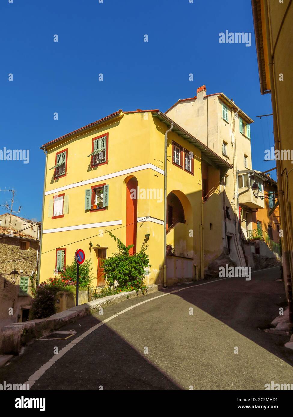 Medieval street in the old town of Menton, France. Menton is a small ...