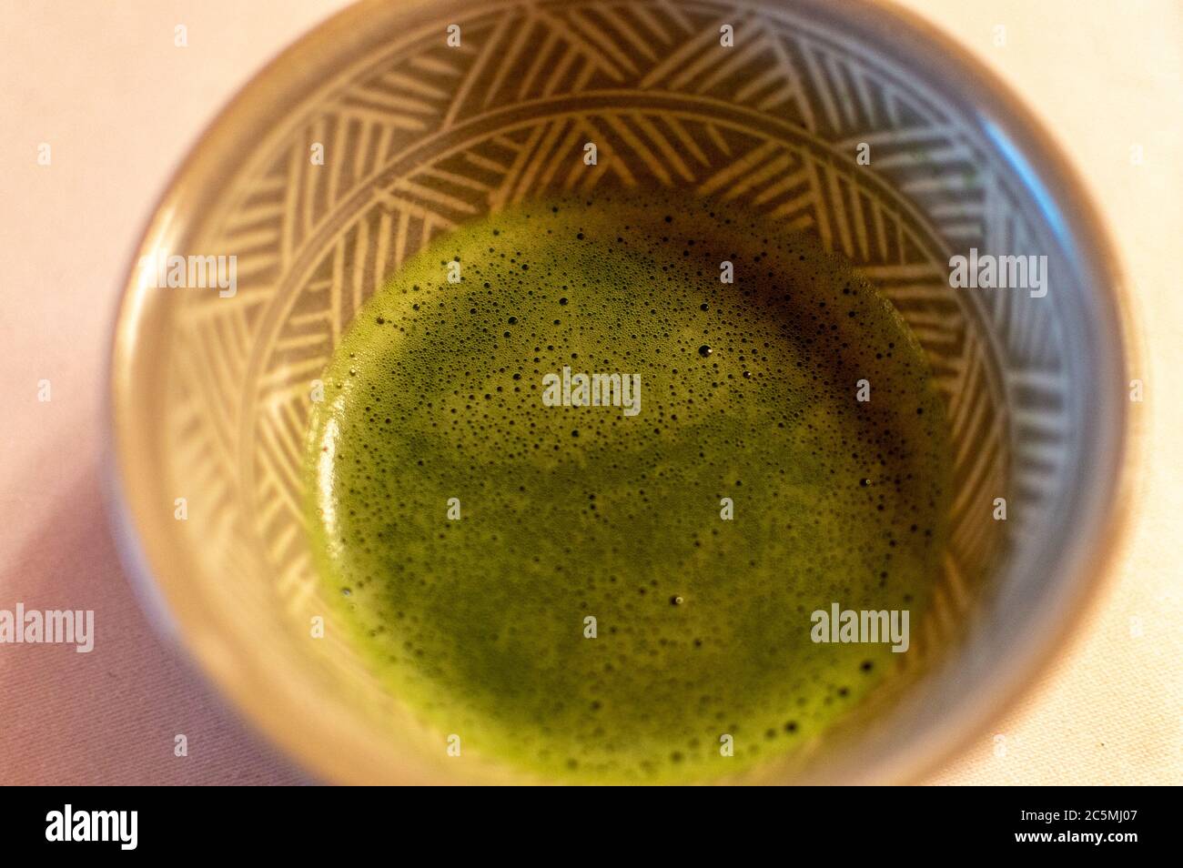 A bowl of matcha green tea served during traditional Japanese tea ...