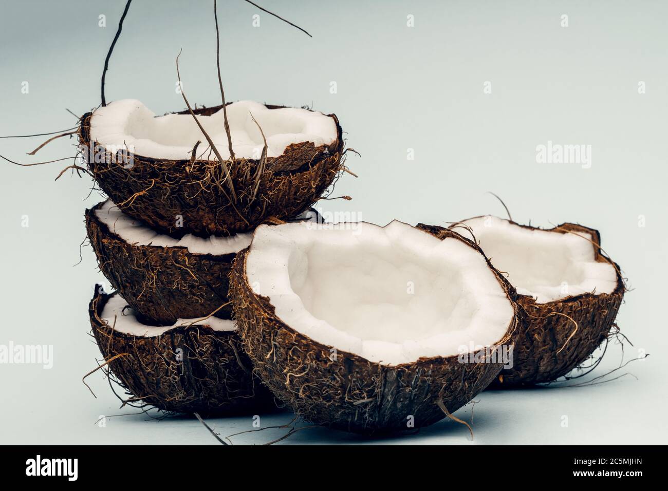 Parts of coconut on a colored background. Close up. Fresh ripe coconut ...