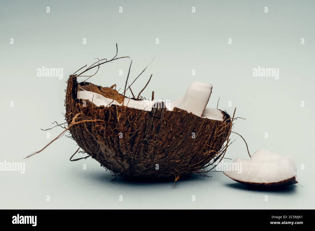Parts of coconut on a colored background. Close up. Fresh ripe coconut ...