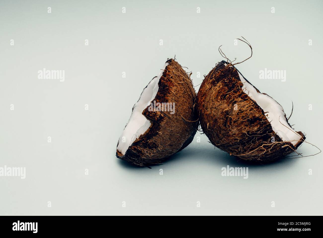 Parts of coconut on a colored background. Close up. Fresh ripe coconut ...