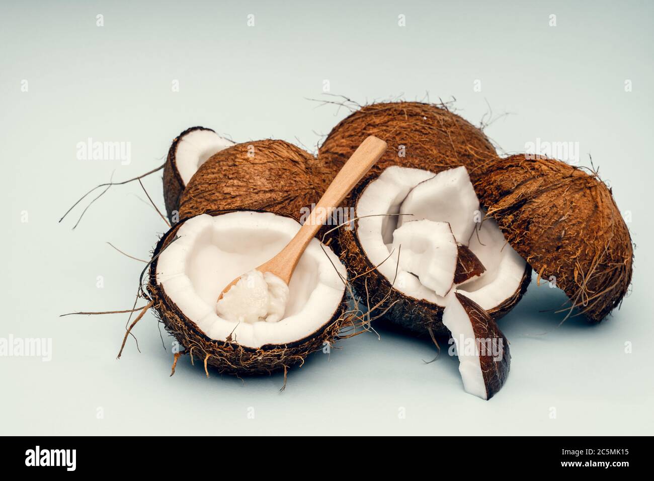 Parts of coconut on a colored background. Close up. Fresh ripe coconut ...