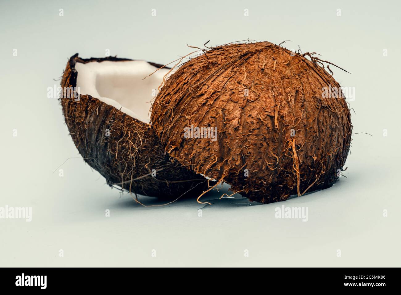 Parts of coconut on a colored background. Close up. Fresh ripe coconut ...