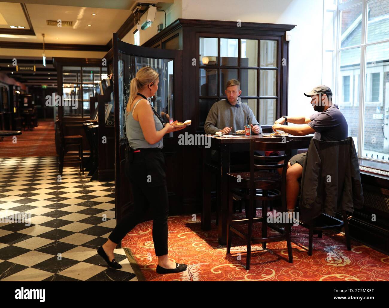 Customers ordering breakfast at the Shakespeares Head pub in Holborn ...