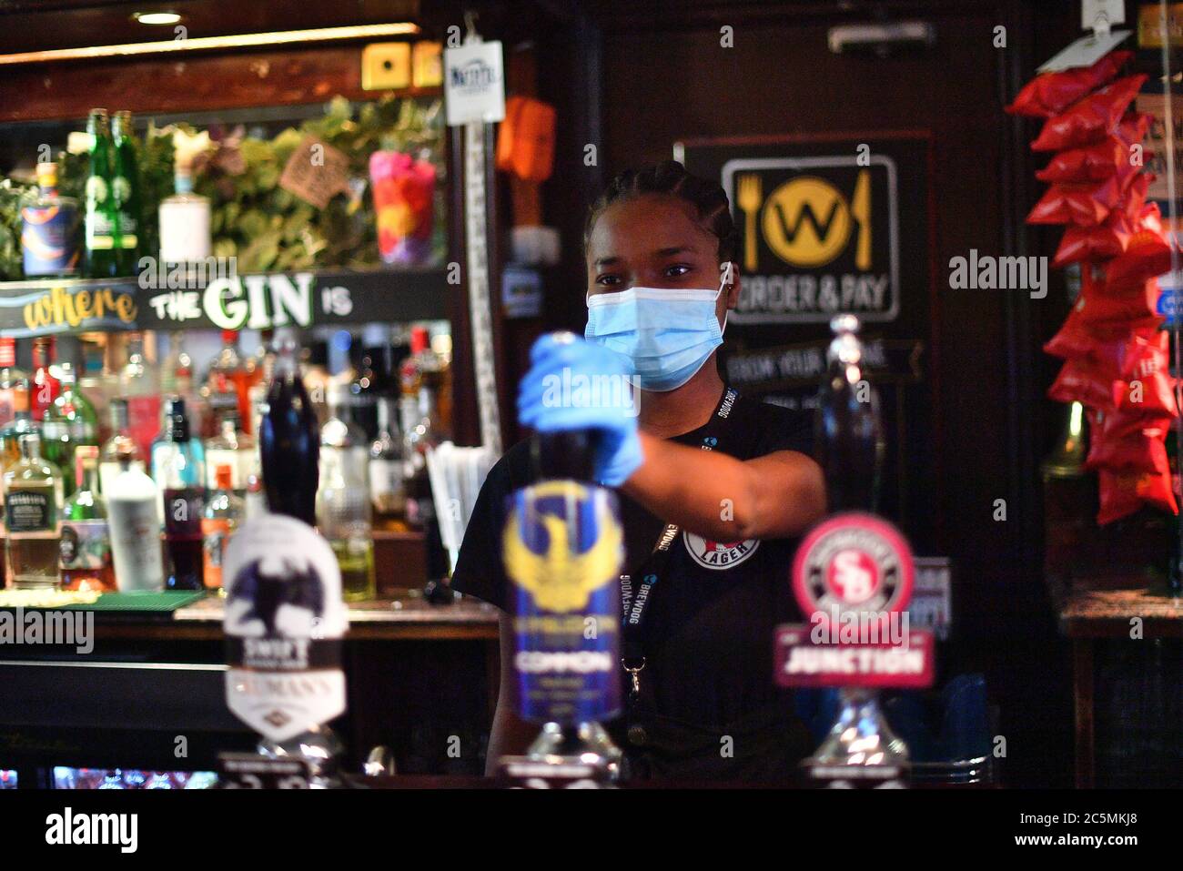 Bar staff waits for customers at the Rochester Castle pub in Stoke ...