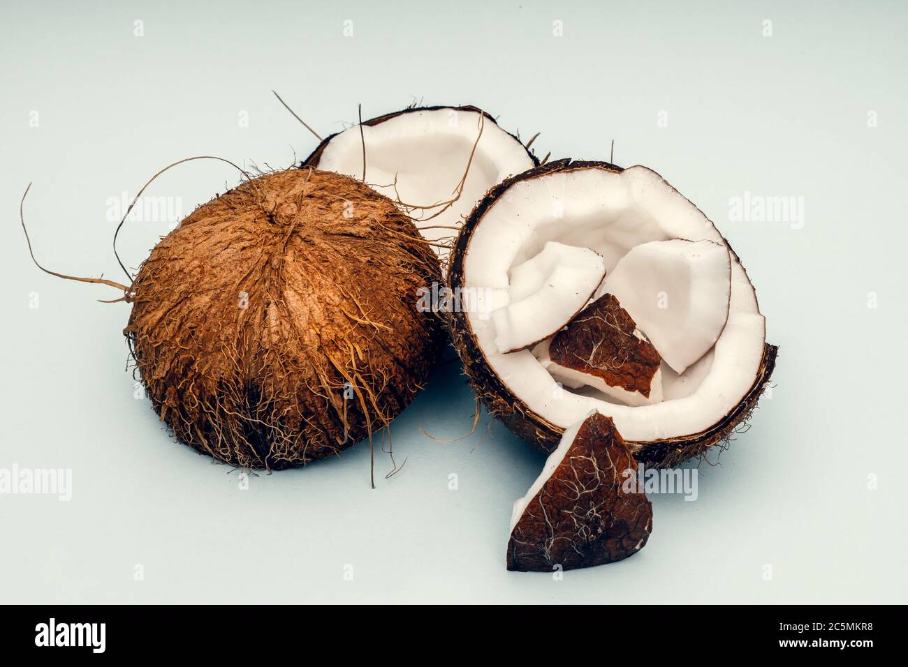 Parts of coconut on a colored background. Close up. Fresh ripe coconut ...