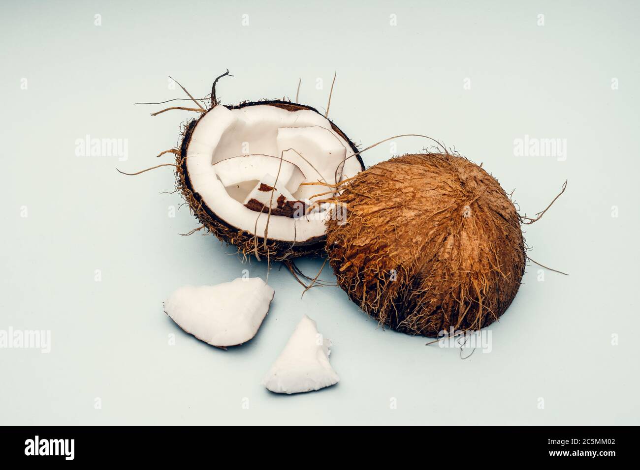 Parts of coconut on a colored background. Close up. Fresh ripe coconut ...