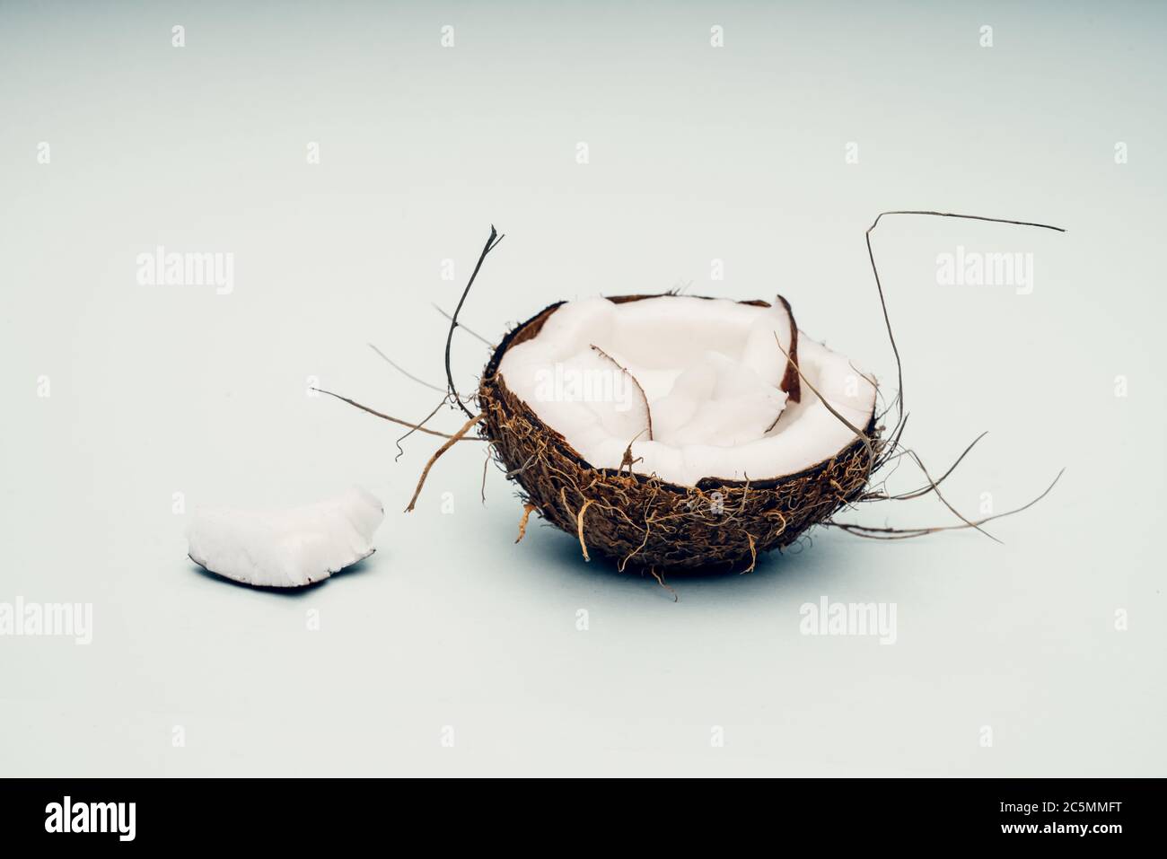 Parts of coconut on a colored background. Close up. Fresh ripe coconut ...