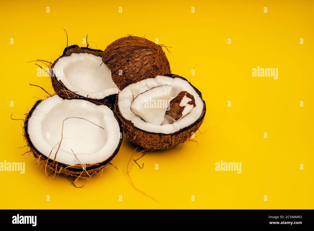 Parts of coconut on a colored background. Close up. Fresh ripe coconut ...