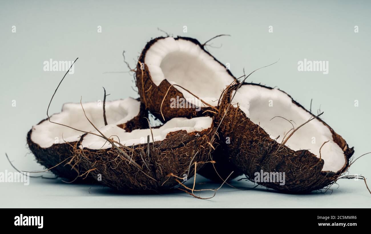 Parts of coconut on a colored background. Close up. Fresh ripe coconut ...