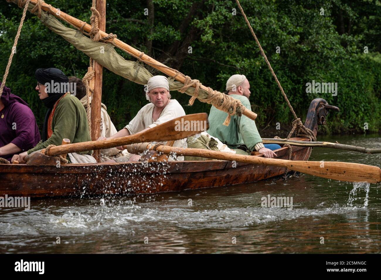 Boating Trip - Replicas of an Old Drakkar. A group of men in casual ...
