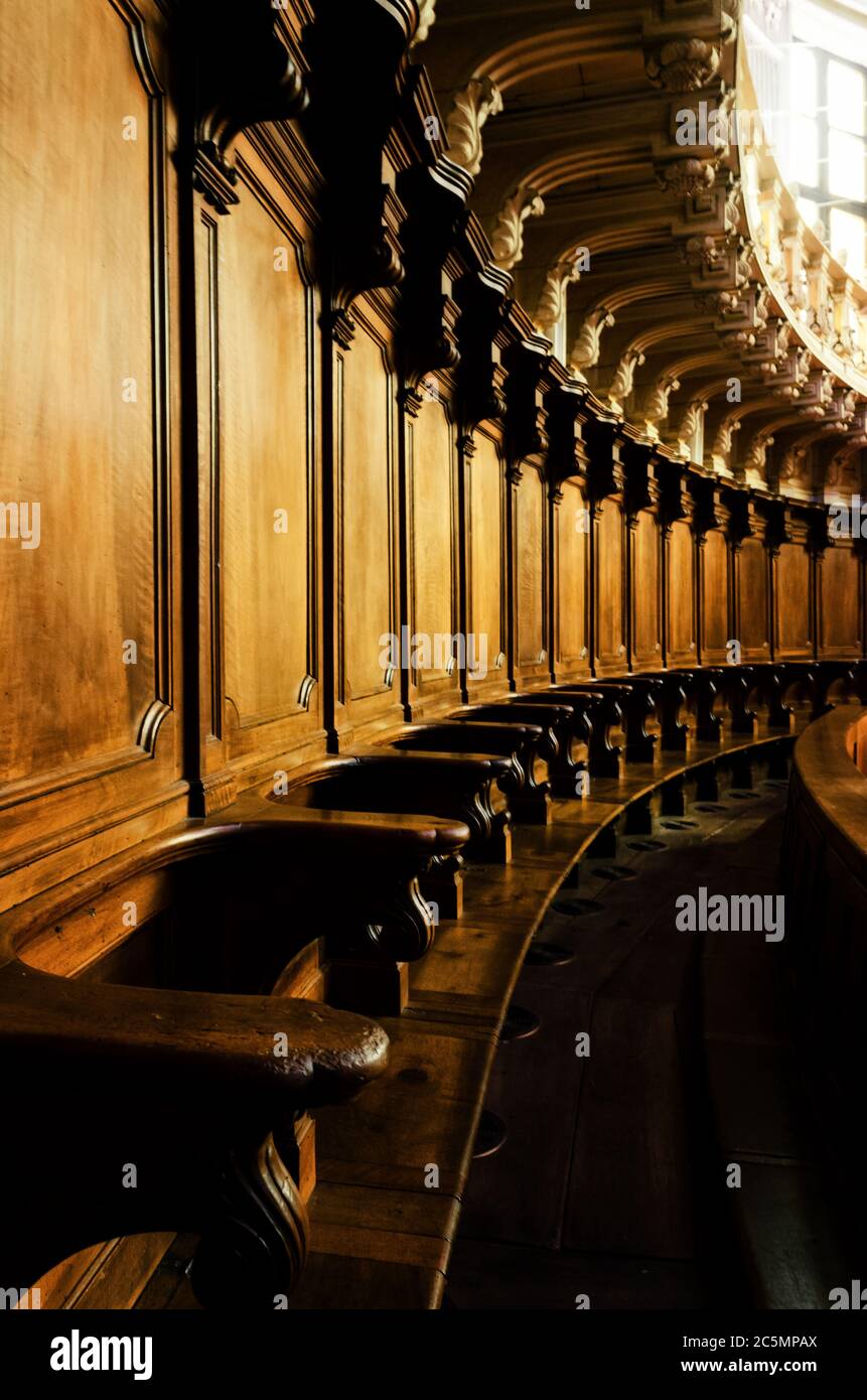Antique wooden choir seating stalls in a baroque chapel in italy Stock ...