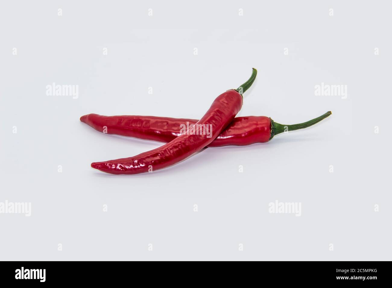 Two Chili peppers isolated on white background. Hot ripen chili peppers ...